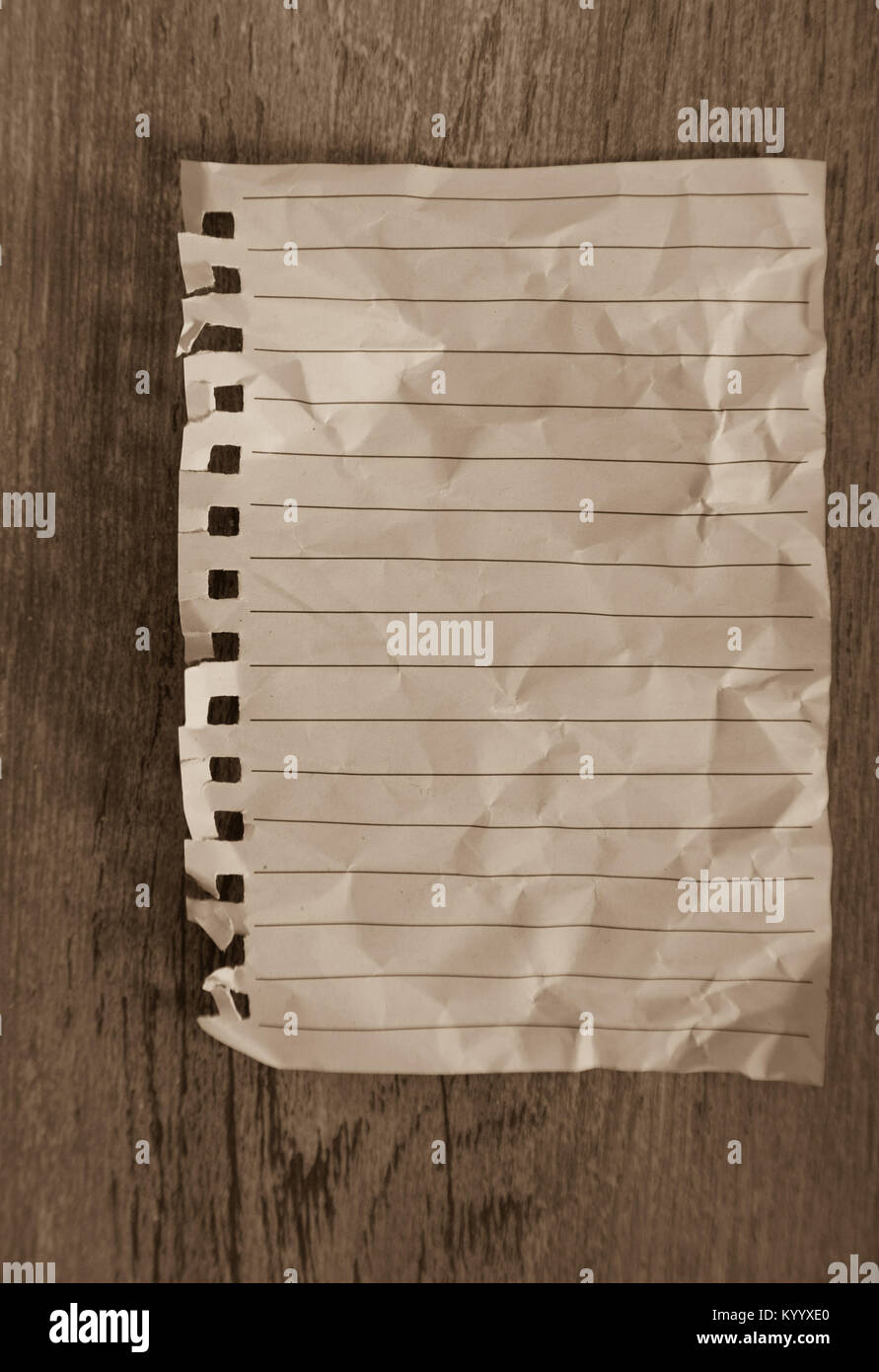 Empty crumpled torn page from notebook lying on wooden surface Stock ...