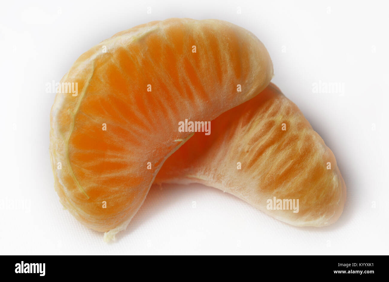 Two Mandarin orange sections on white background Stock Photo - Alamy