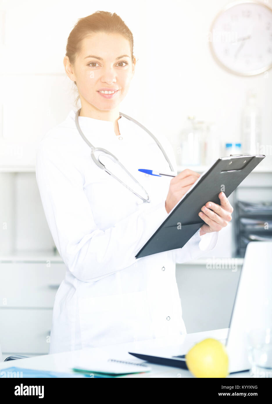 Female doctor having a productive day helping in her office Stock Photo ...