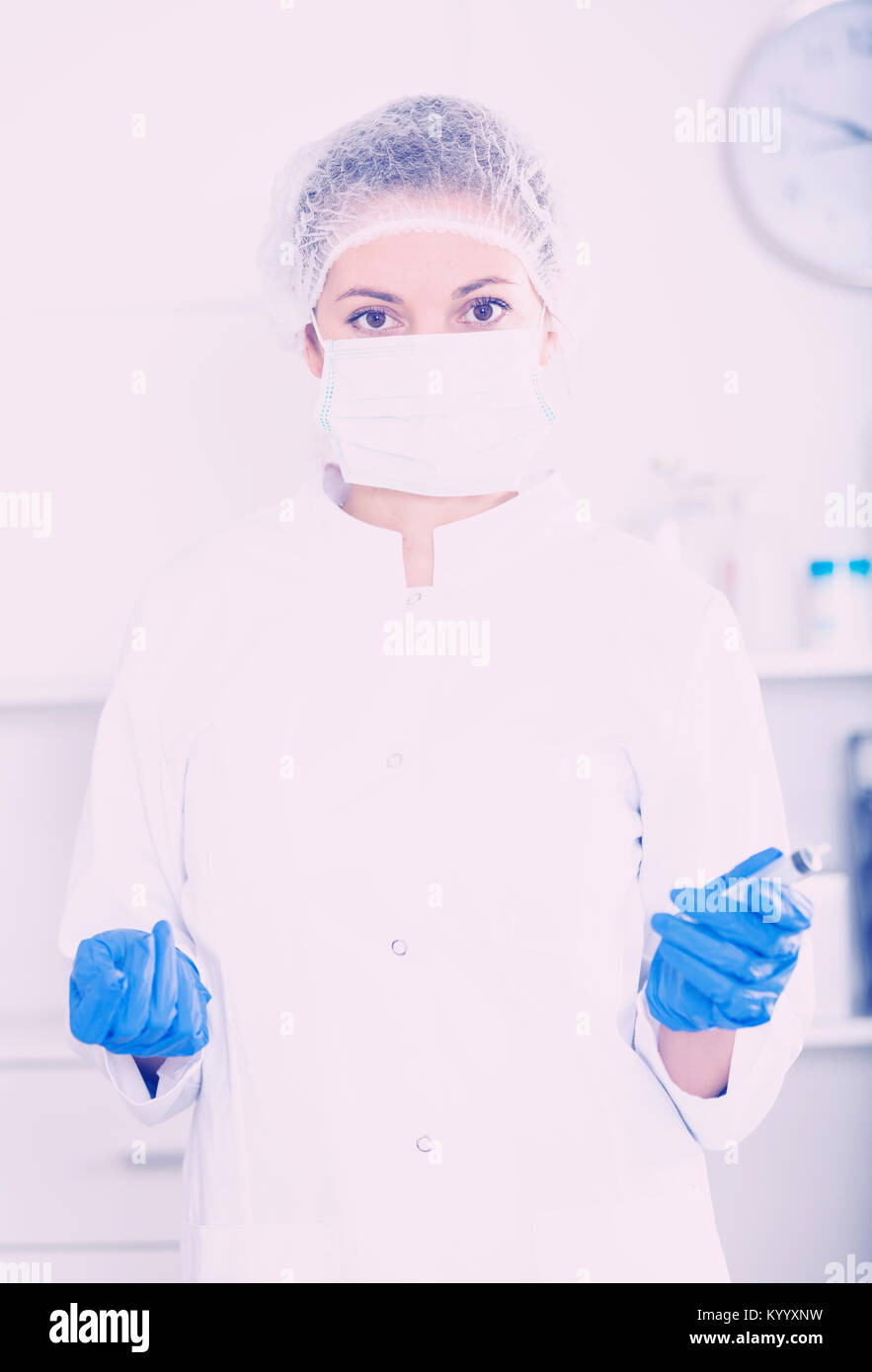 Female nurse holding syringe for injection in hospital Stock Photo - Alamy