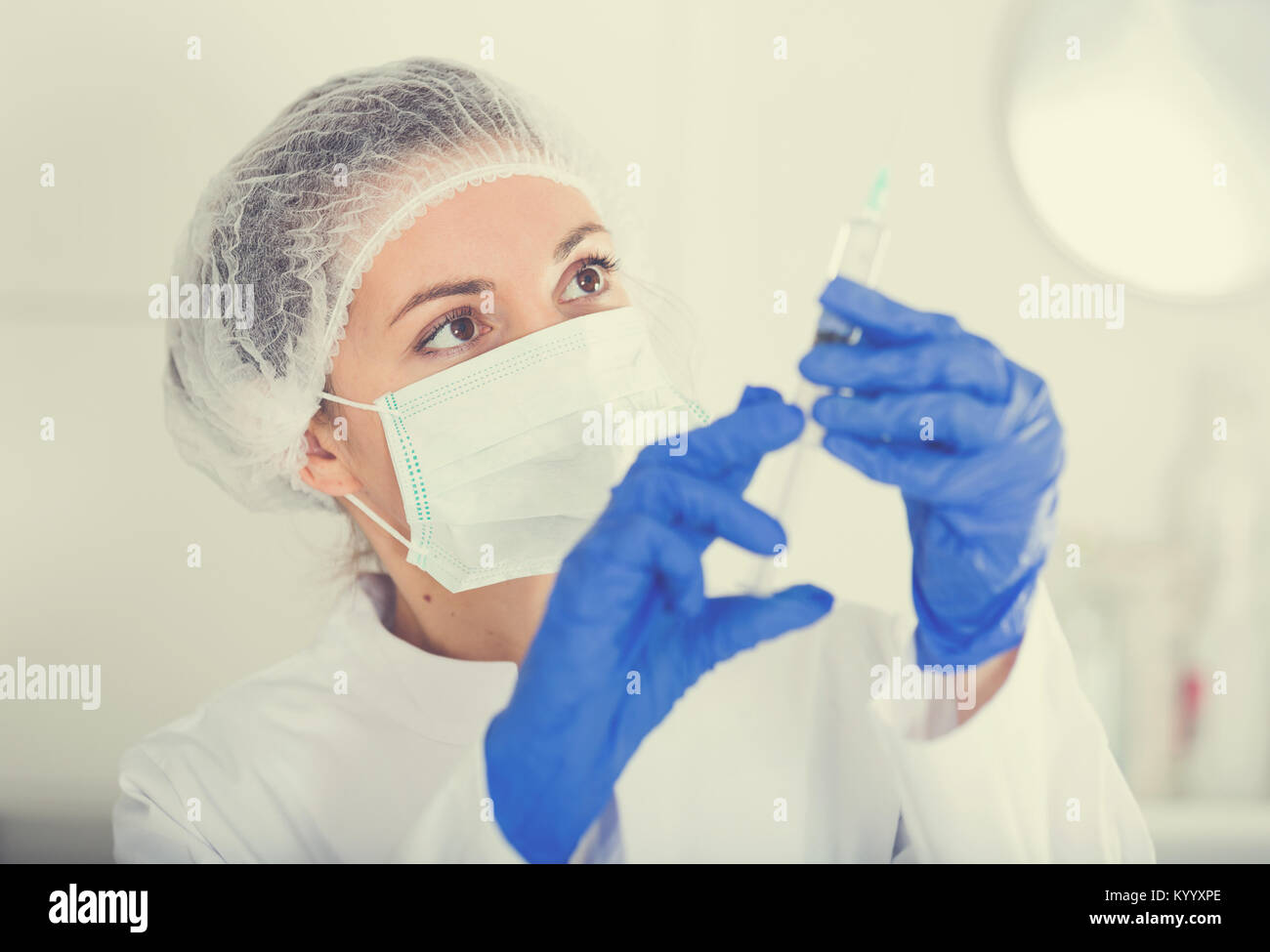 Young female nurse ready to make injection in hospital Stock Photo - Alamy