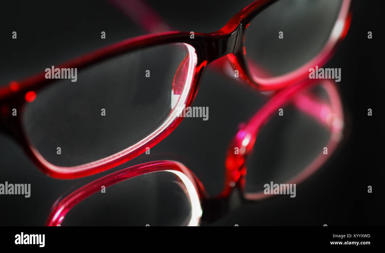 Red glasses reflected in mirror Stock Photo - Alamy