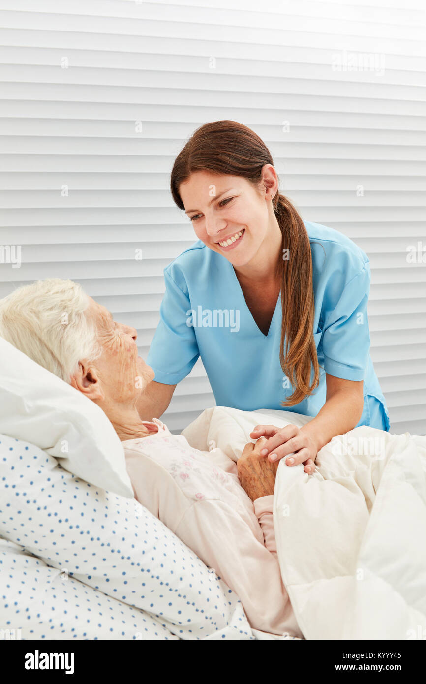 Nurse cares for a sick elderly woman in the hospice or at home Stock ...