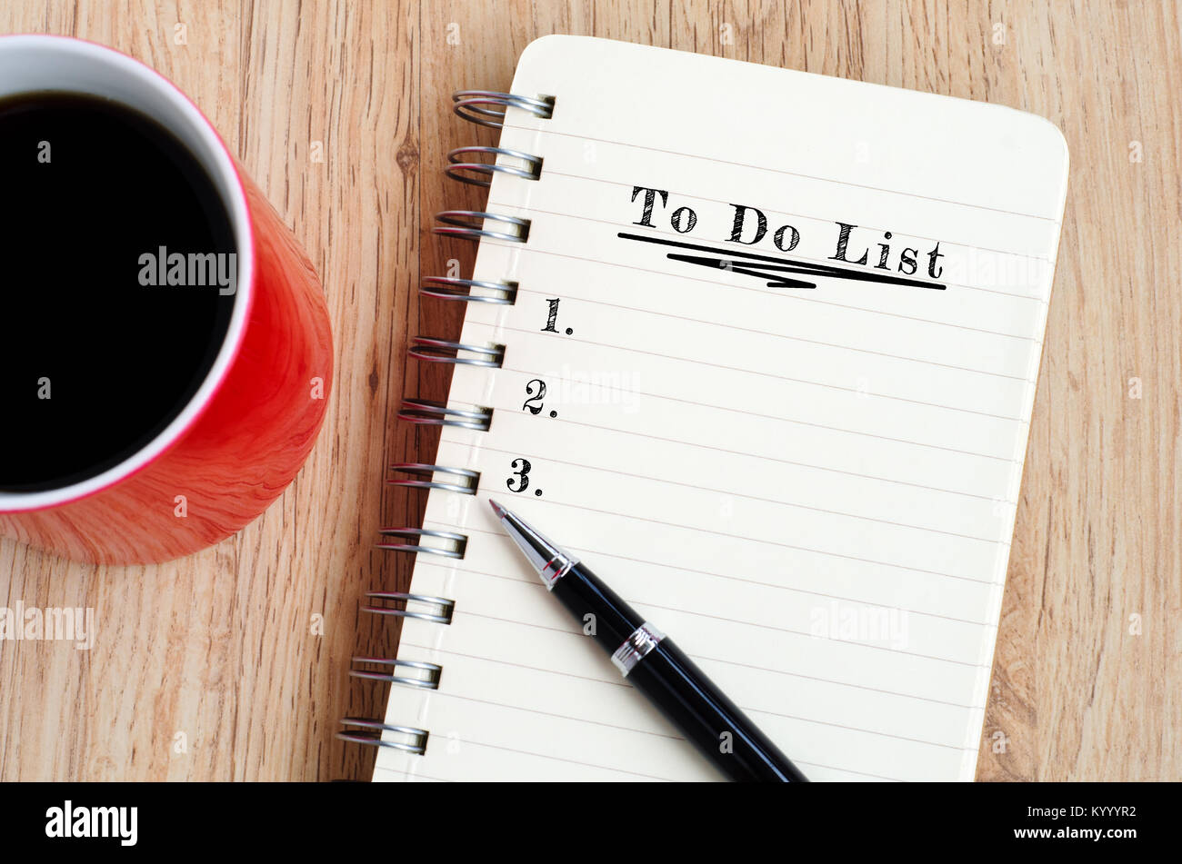 To do list text on notepad with pen and a cup of coffee, wooden ...
