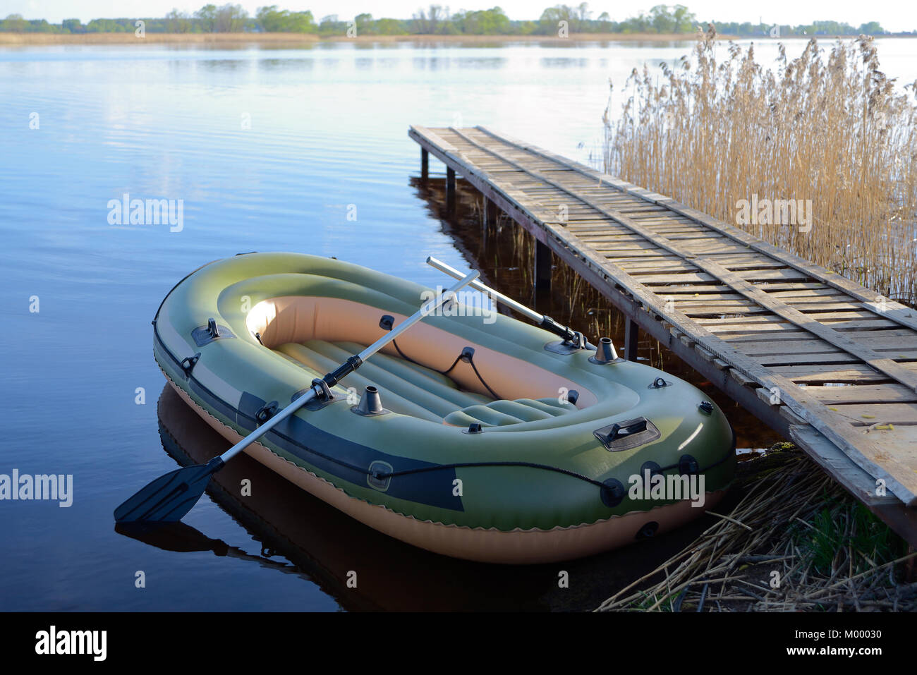 Inflatable boat at the river berth Stock Photo - Alamy