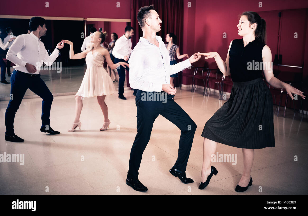 Happy cheerful positive people dancing twist in pairs Stock Photo - Alamy