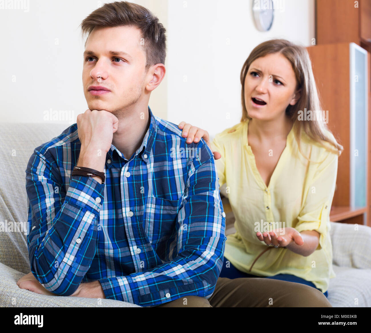 american family couple with serious faces quarrelling at home Stock ...