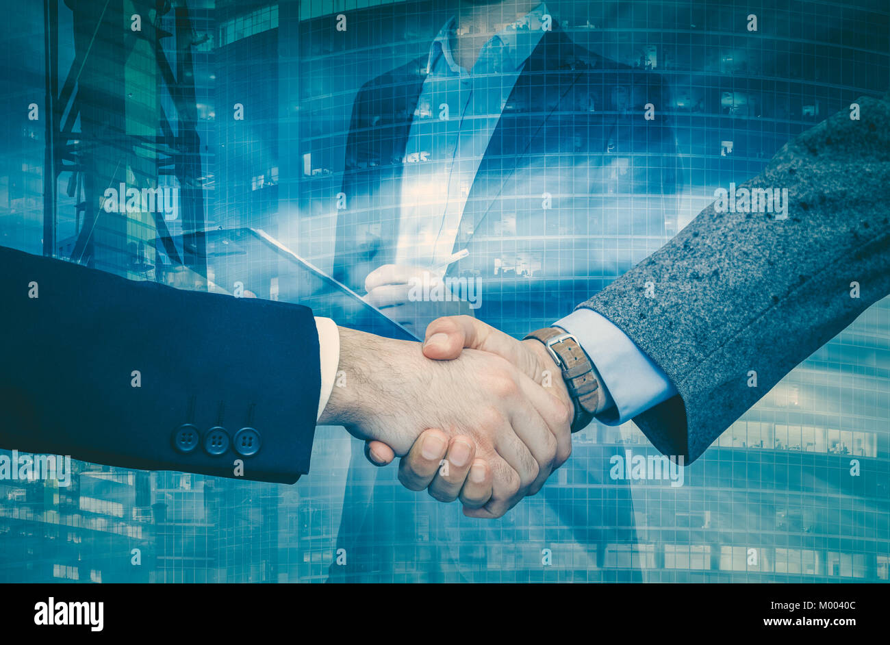 Strong handshake of businessmen confirming successful business ...