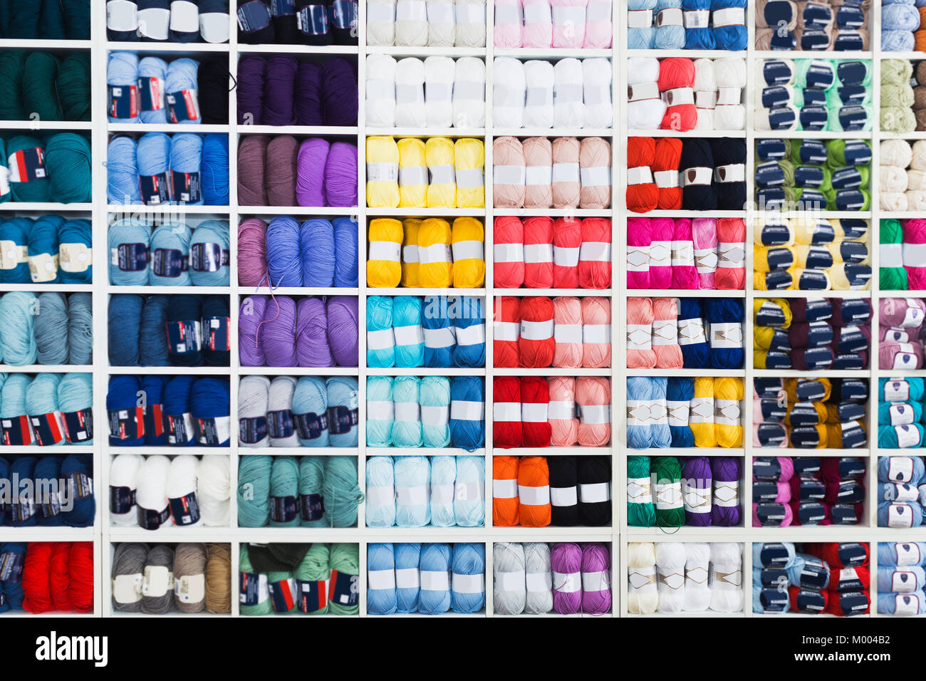 Shelves with colorful wool and yarn in knitting shop Stock Photo - Alamy