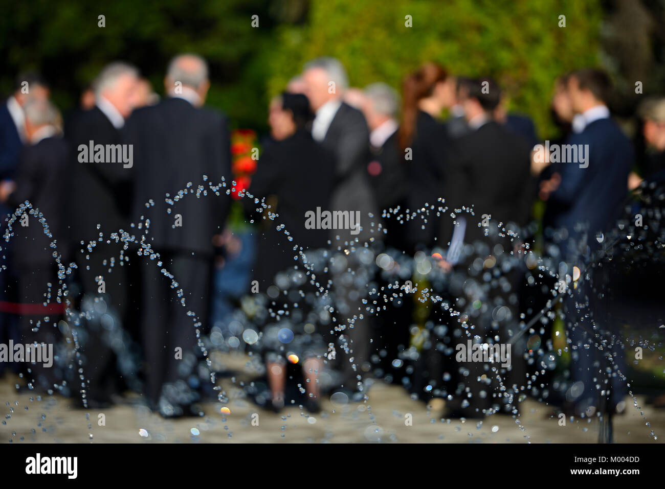 Blurred people in black suits on funeral Stock Photo - Alamy
