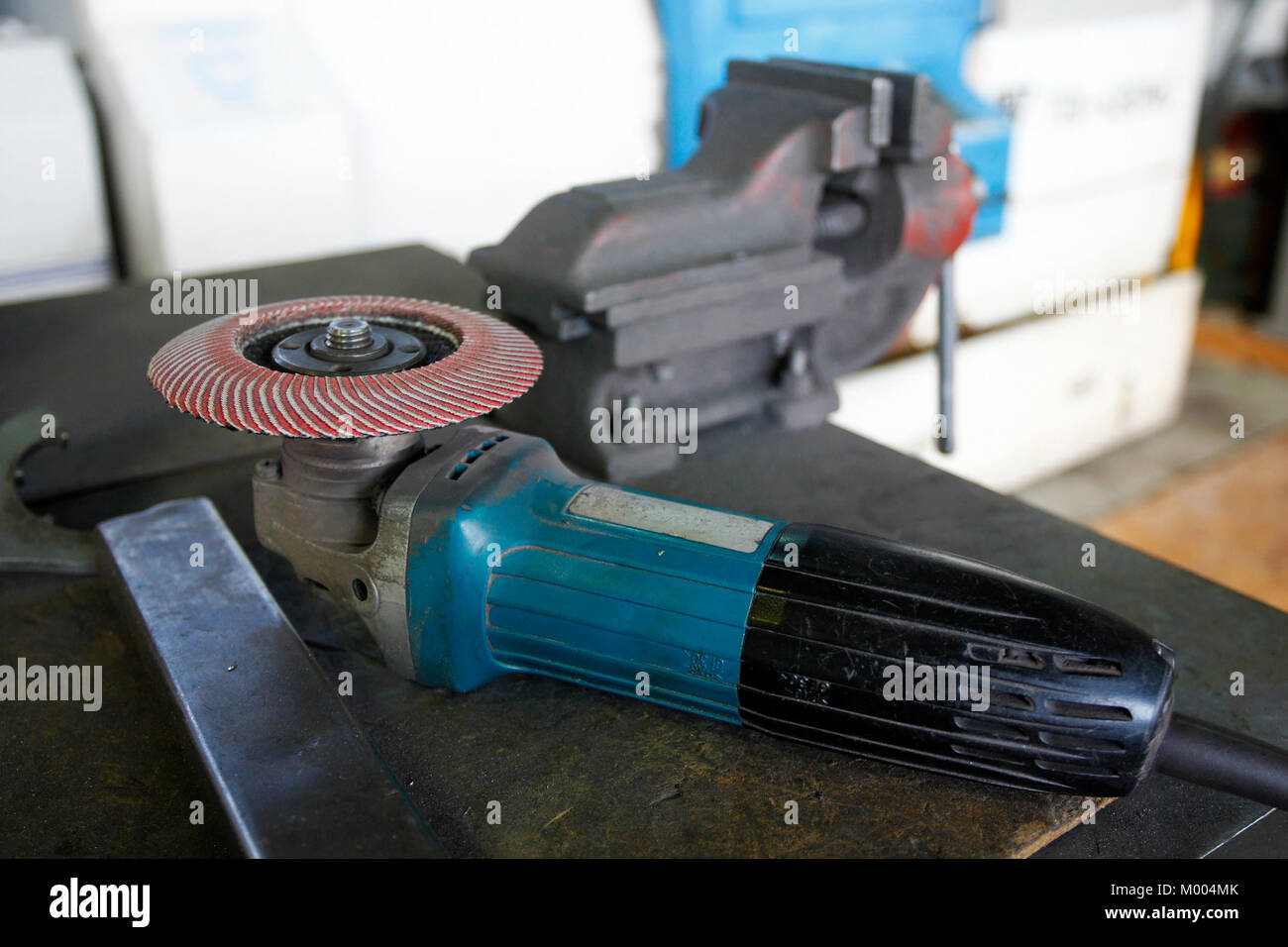 A grinder and other working tools on a factory table Stock Photo - Alamy