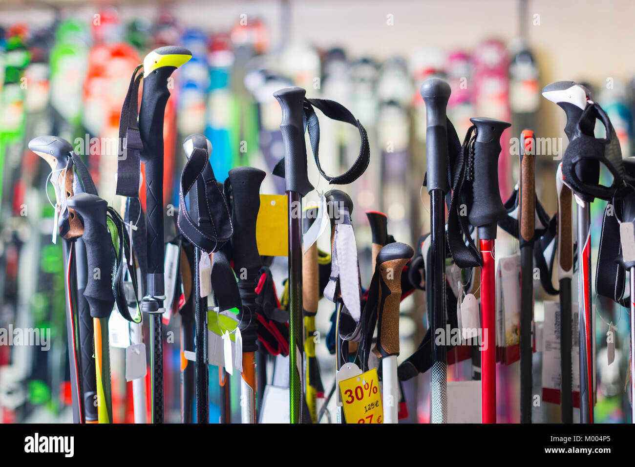 new ski-sticks on showcase of store Stock Photo - Alamy
