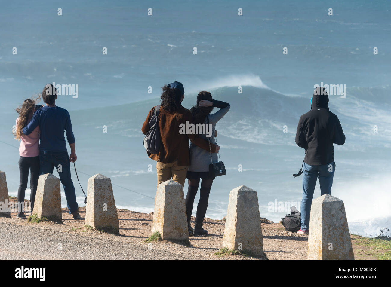 People watching large waves at Nazare, Portugal Stock Photo - Alamy