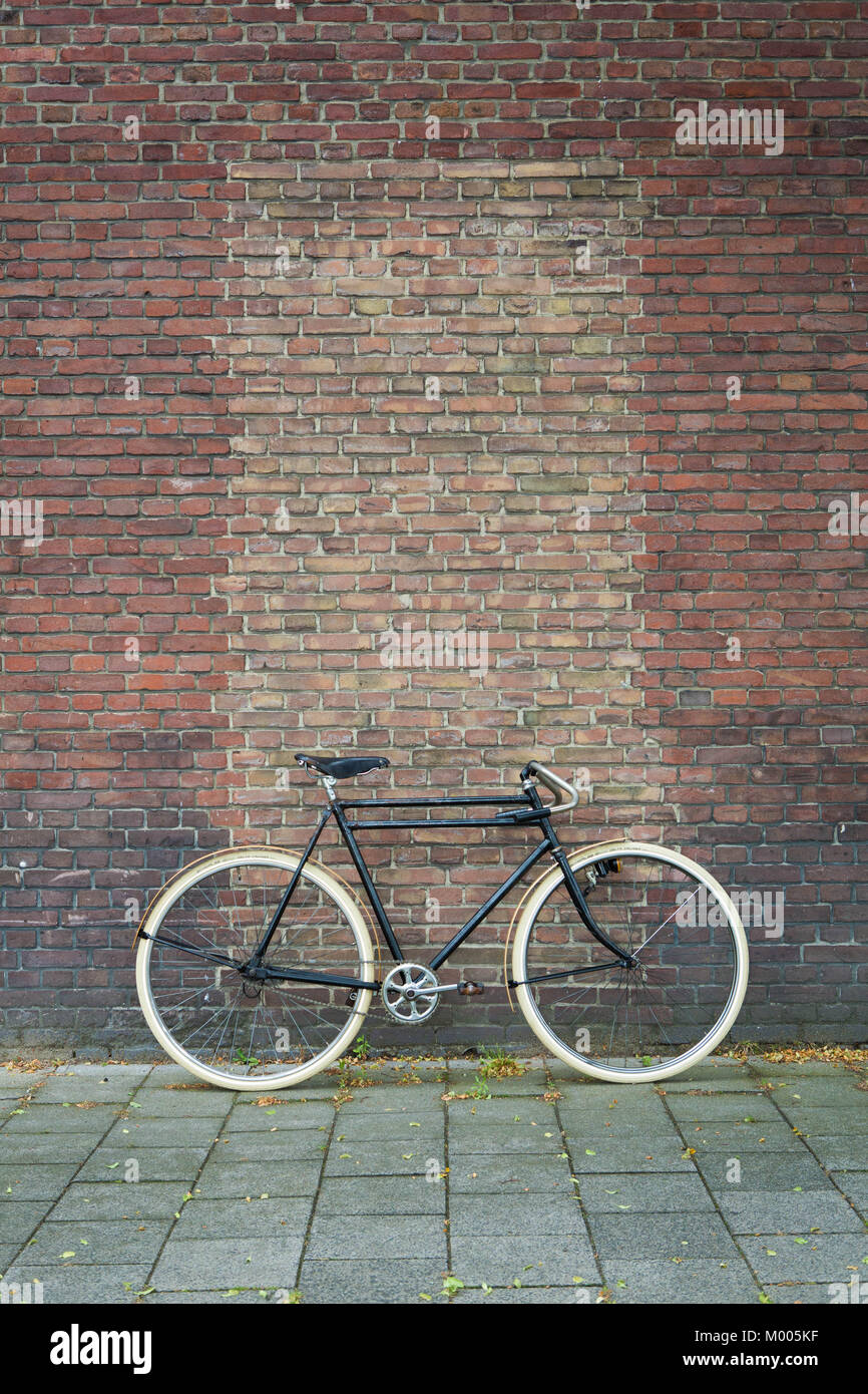 Vintage Path Racer bike with a double frame in front of a brick wall ...
