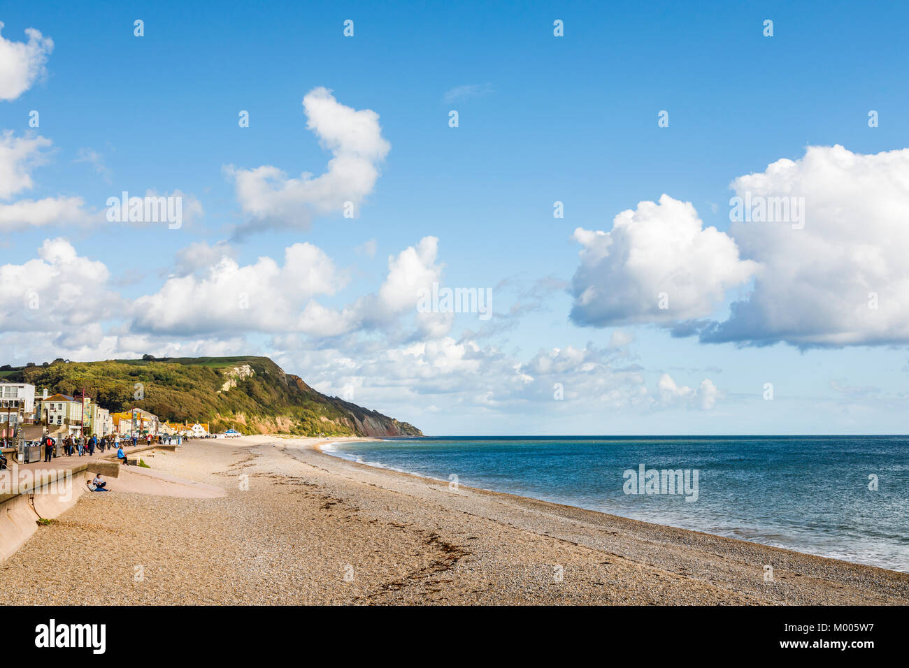 View of stony beach, cliffs and seafront promenade at Seaton, a holiday ...