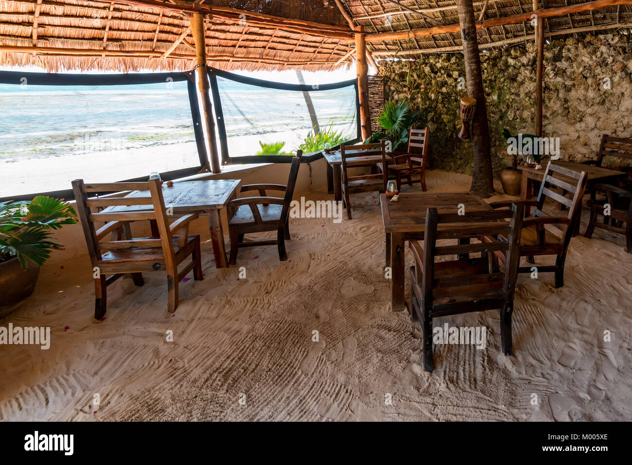 Beach cafe interior with wooden furniture Stock Photo - Alamy