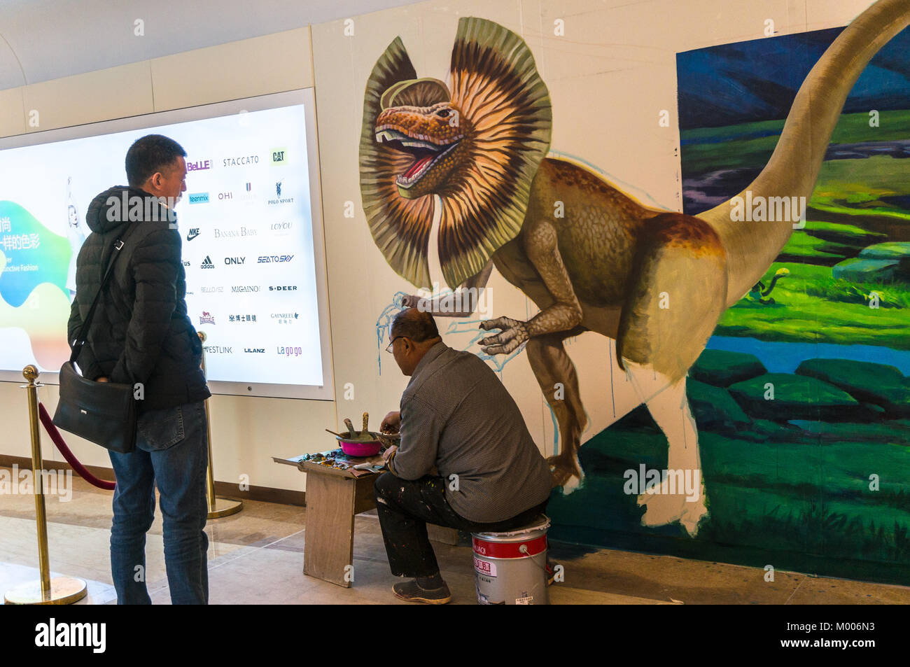 Elderly artist paints a dinosaur as a bystander watches in Shenzhen ...