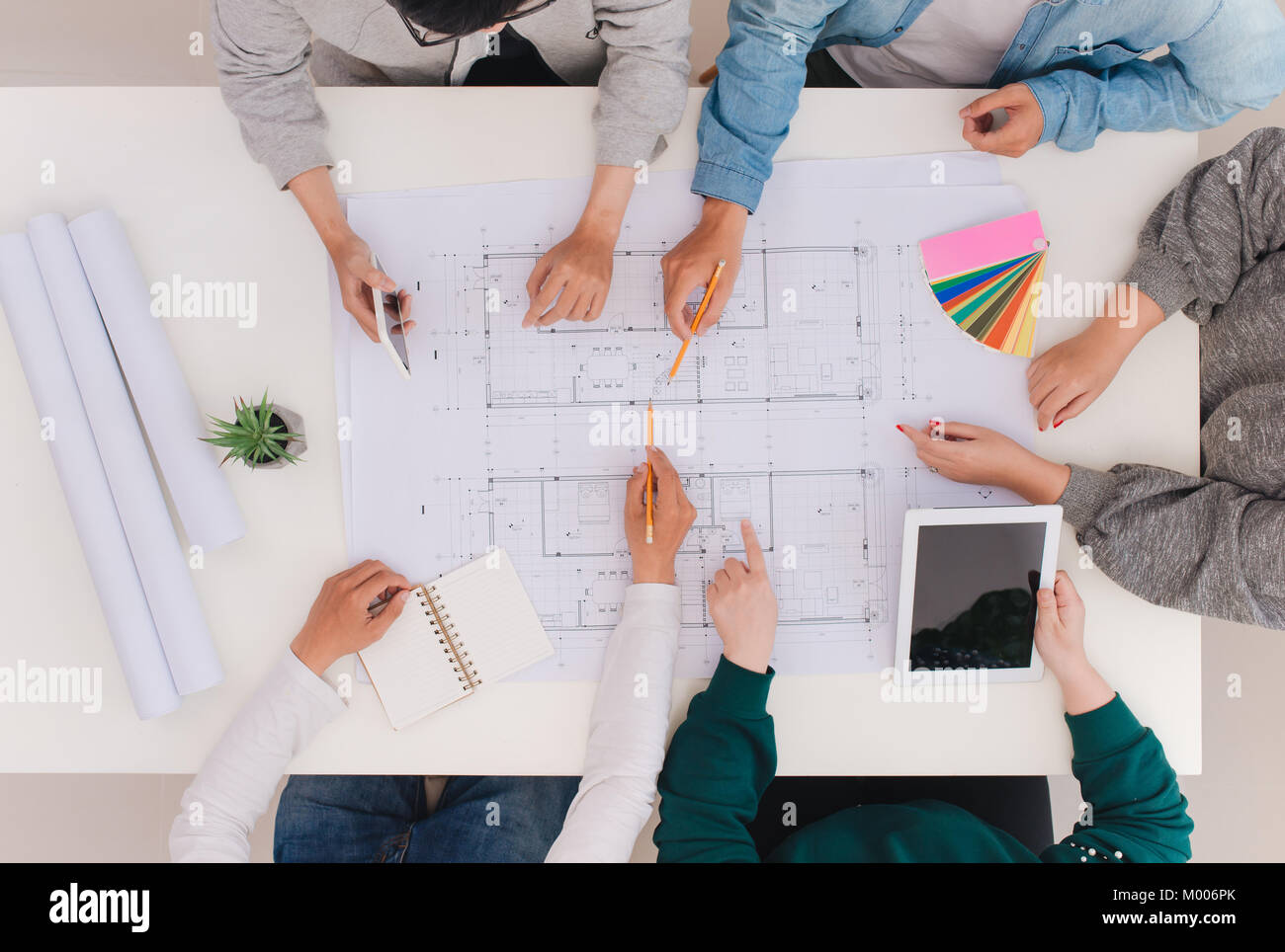 Team work concept. Male and female architect colleagues drawing graphic ...