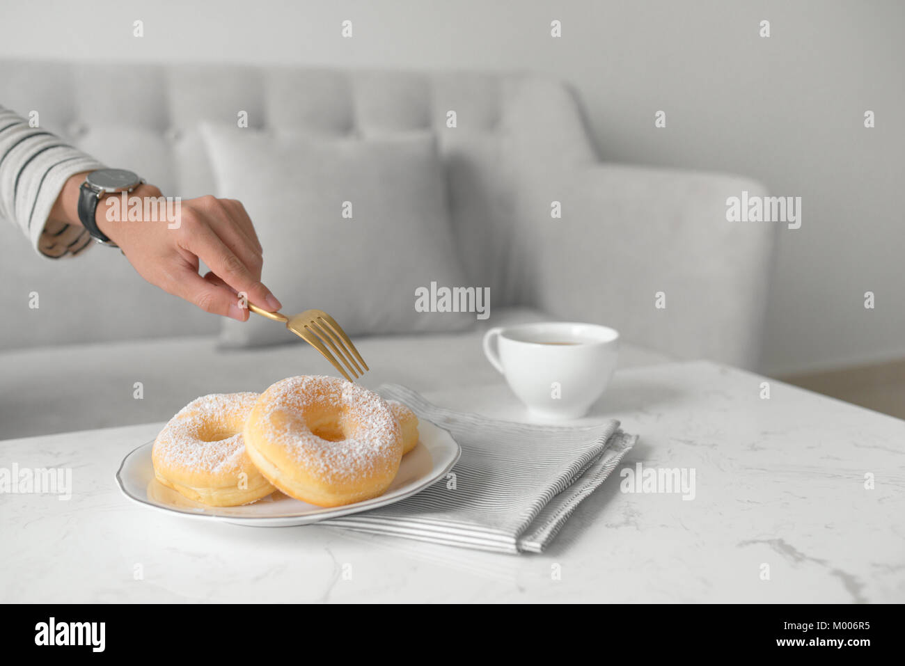 Hand grabbing donut hi-res stock photography and images - Alamy