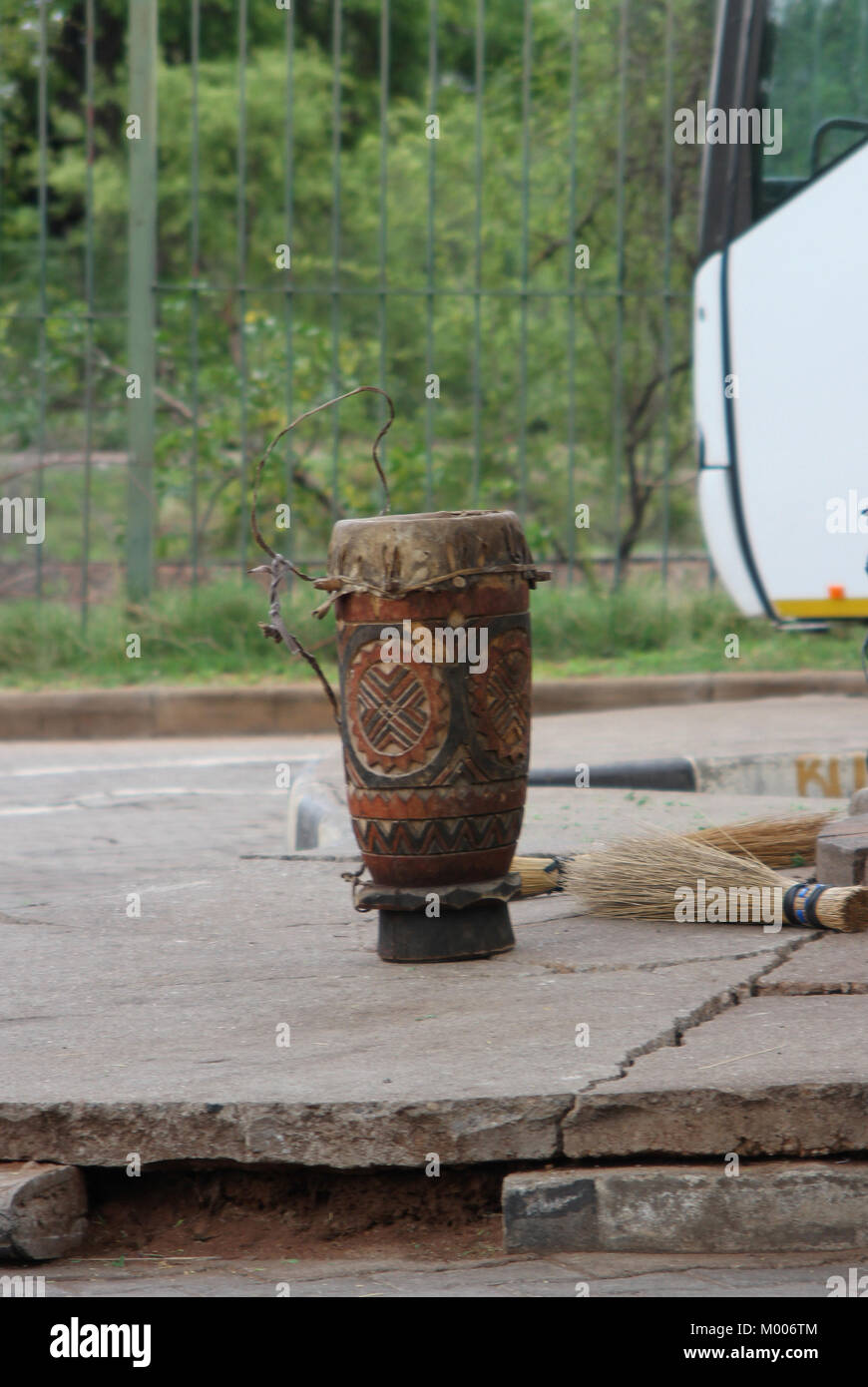 Djembe drum and a broom at a bus stop, Victoria Falls, Zimbabwe Stock ...