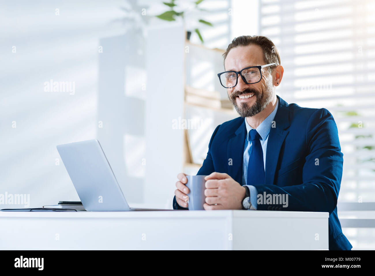 Happy energetic man drinking coffee Stock Photo - Alamy
