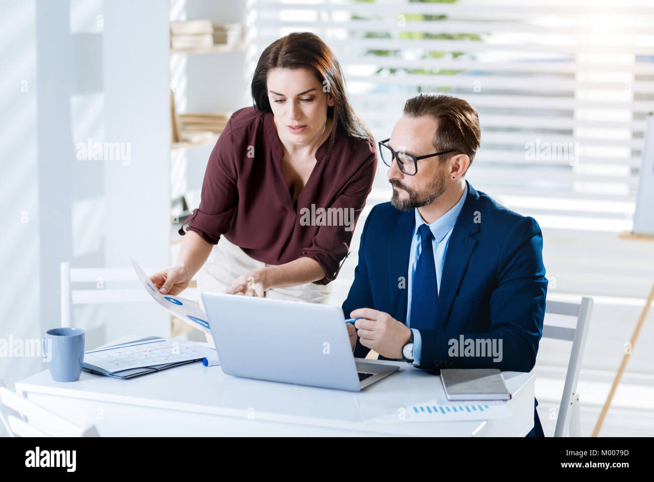 Active two colleagues helping each other Stock Photo - Alamy