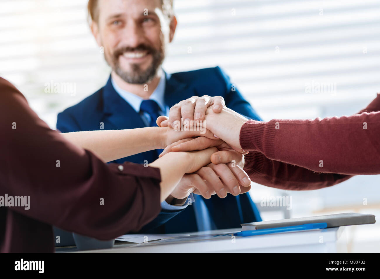 Team work three human hands hi-res stock photography and images - Alamy