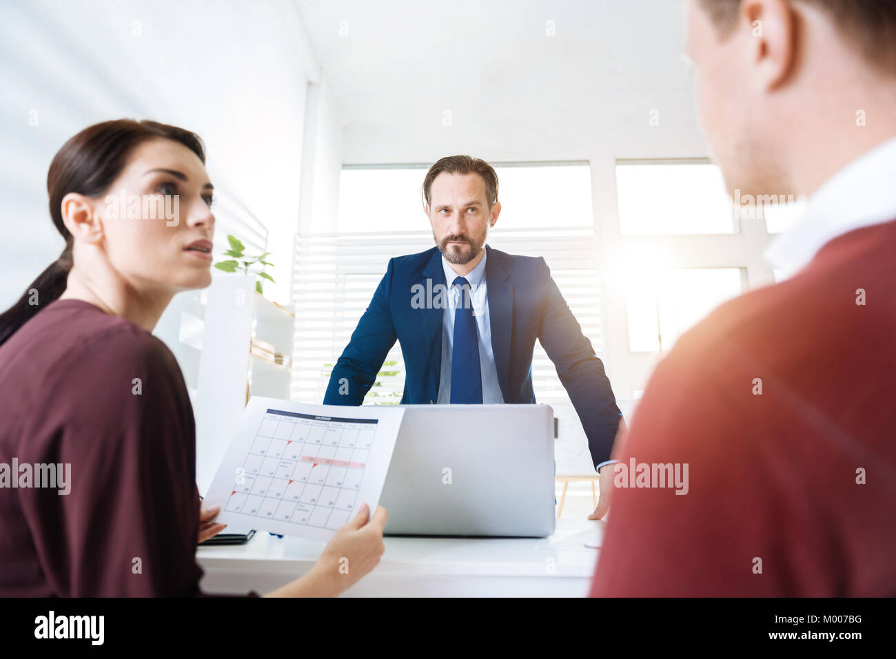 Young three colleagues facing problems Stock Photo - Alamy