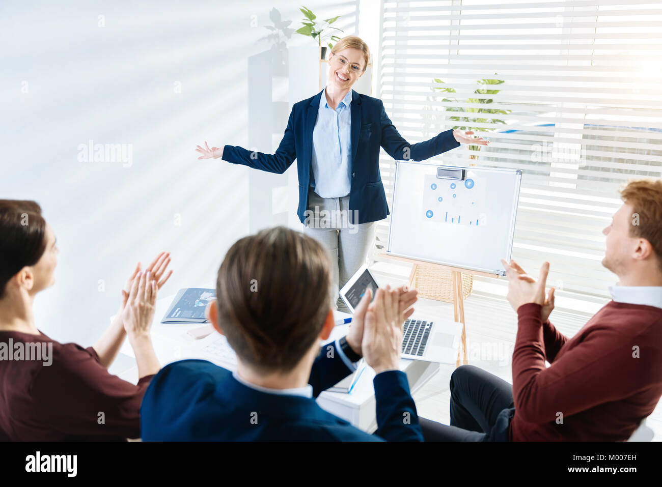 Grateful female colleague thanking her colleagues Stock Photo - Alamy