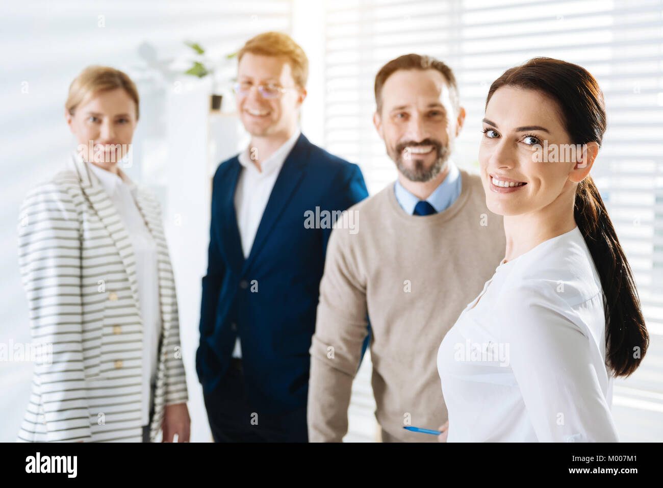 Beautiful female colleague spending time with colleagues Stock Photo ...