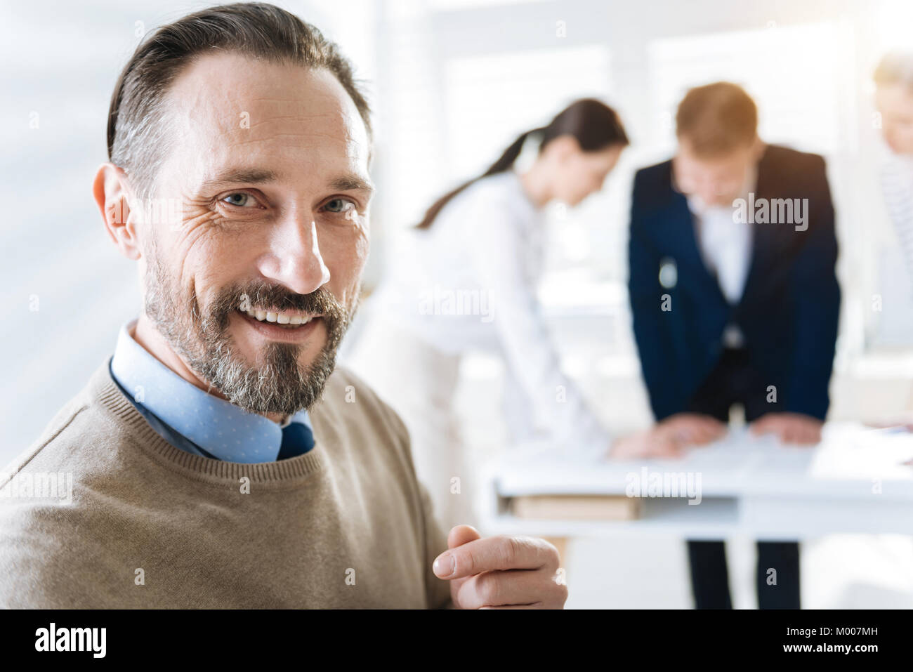 Energetic male colleague enlightening with ideas Stock Photo - Alamy