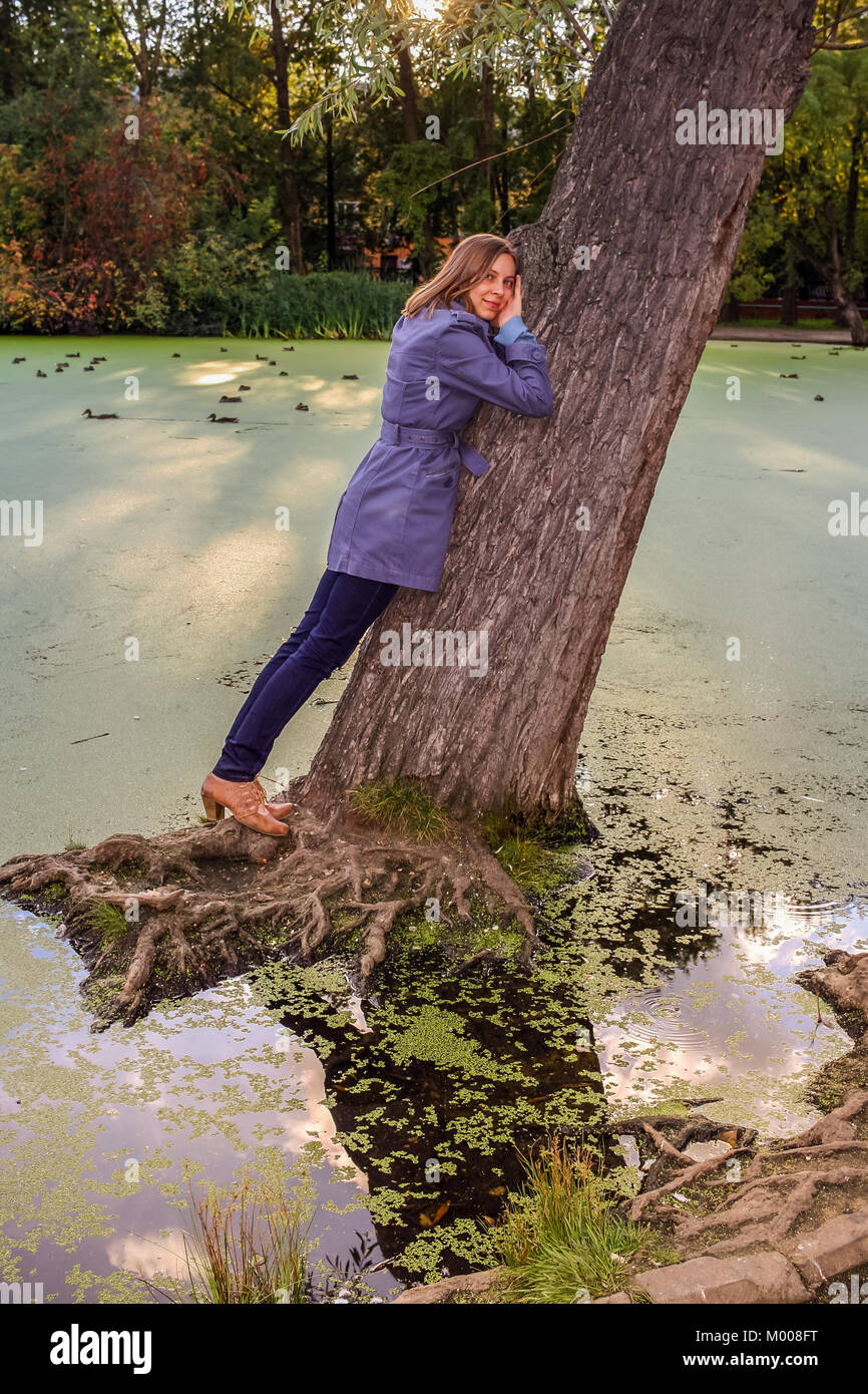 Bending down hi-res stock photography and images - Alamy