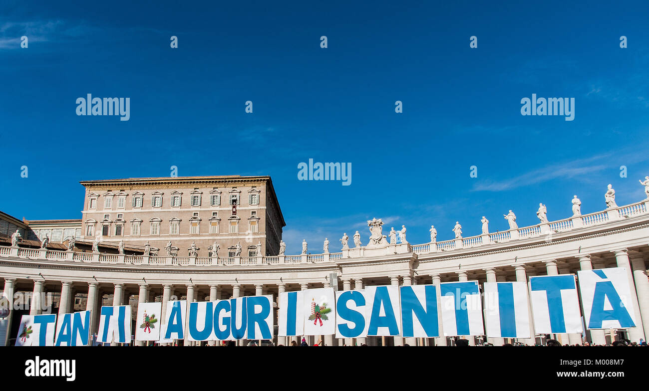 Faithful hold placards reading "Best Wishes Her Holiness" on the ...