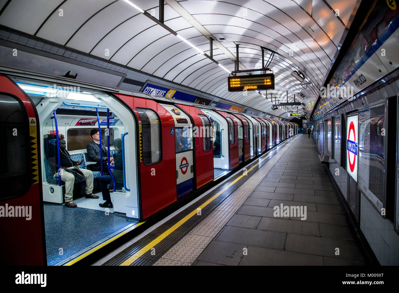 Underground train at the Pimlico station on the Victoria line, London ...
