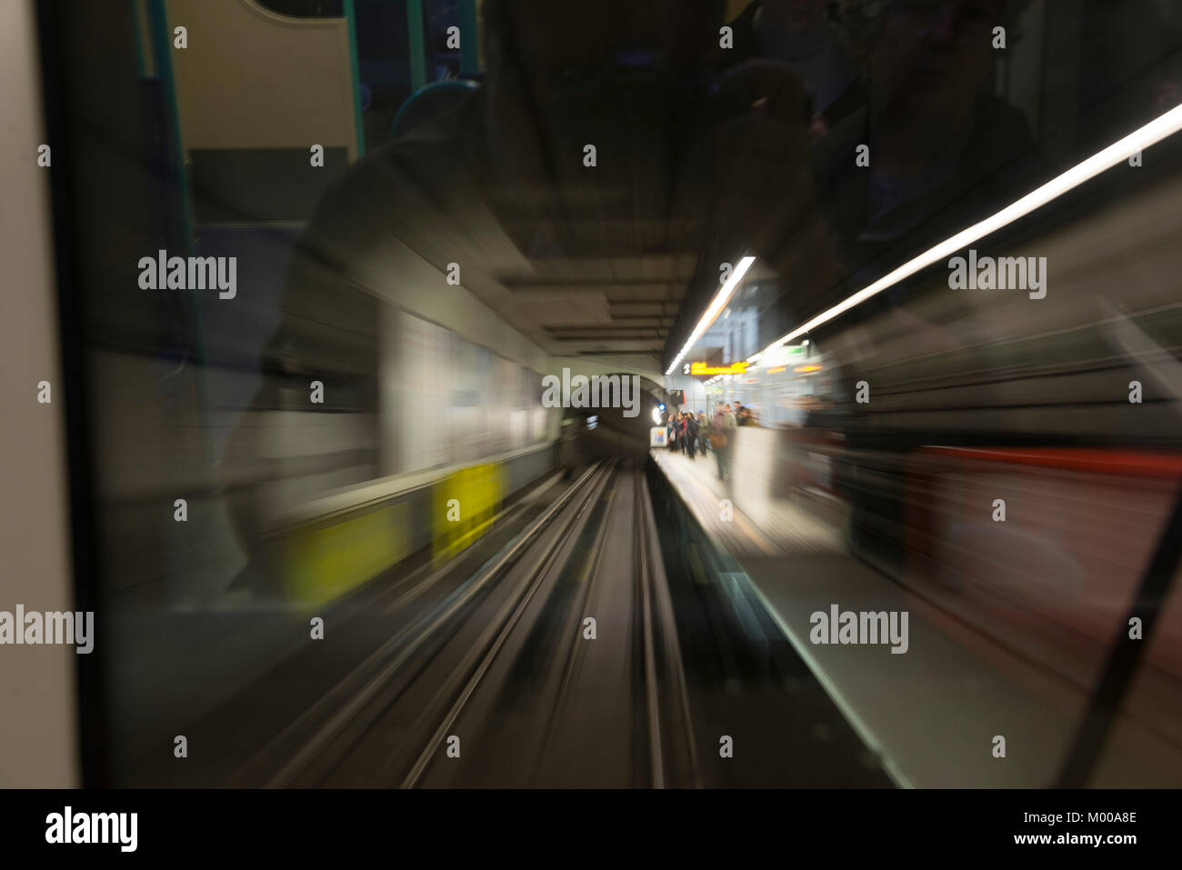 Driverless train arriving at a station on the Dockland Light Railway ...