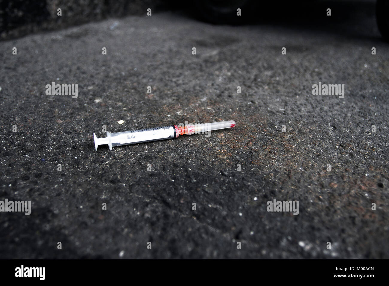Leftovers from a drug abuser: bloody syringes. Copenhagen 2012 Stock ...