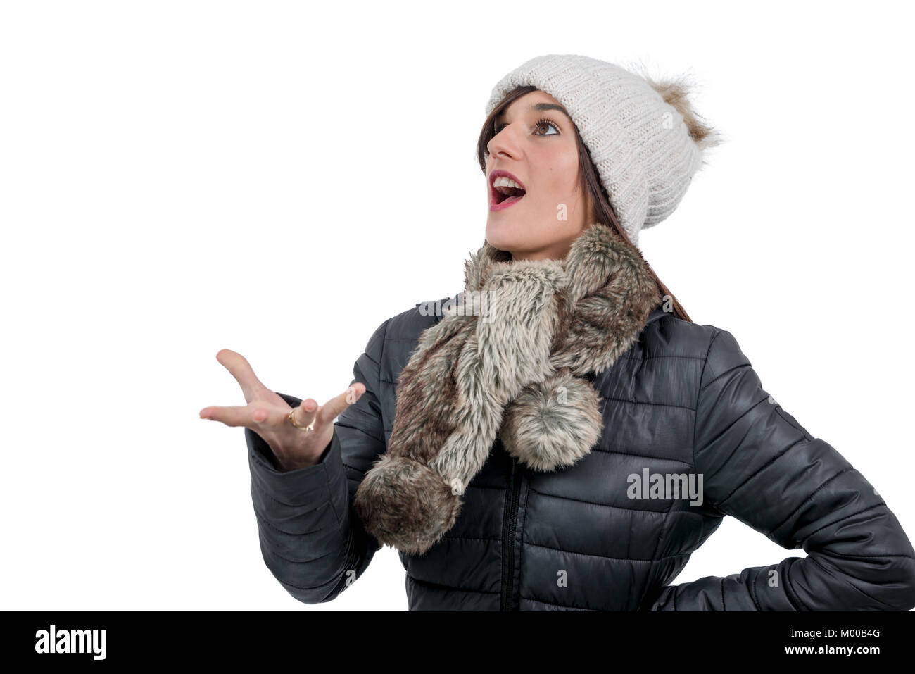 A woman throwing something in the air, isolated on the white background ...