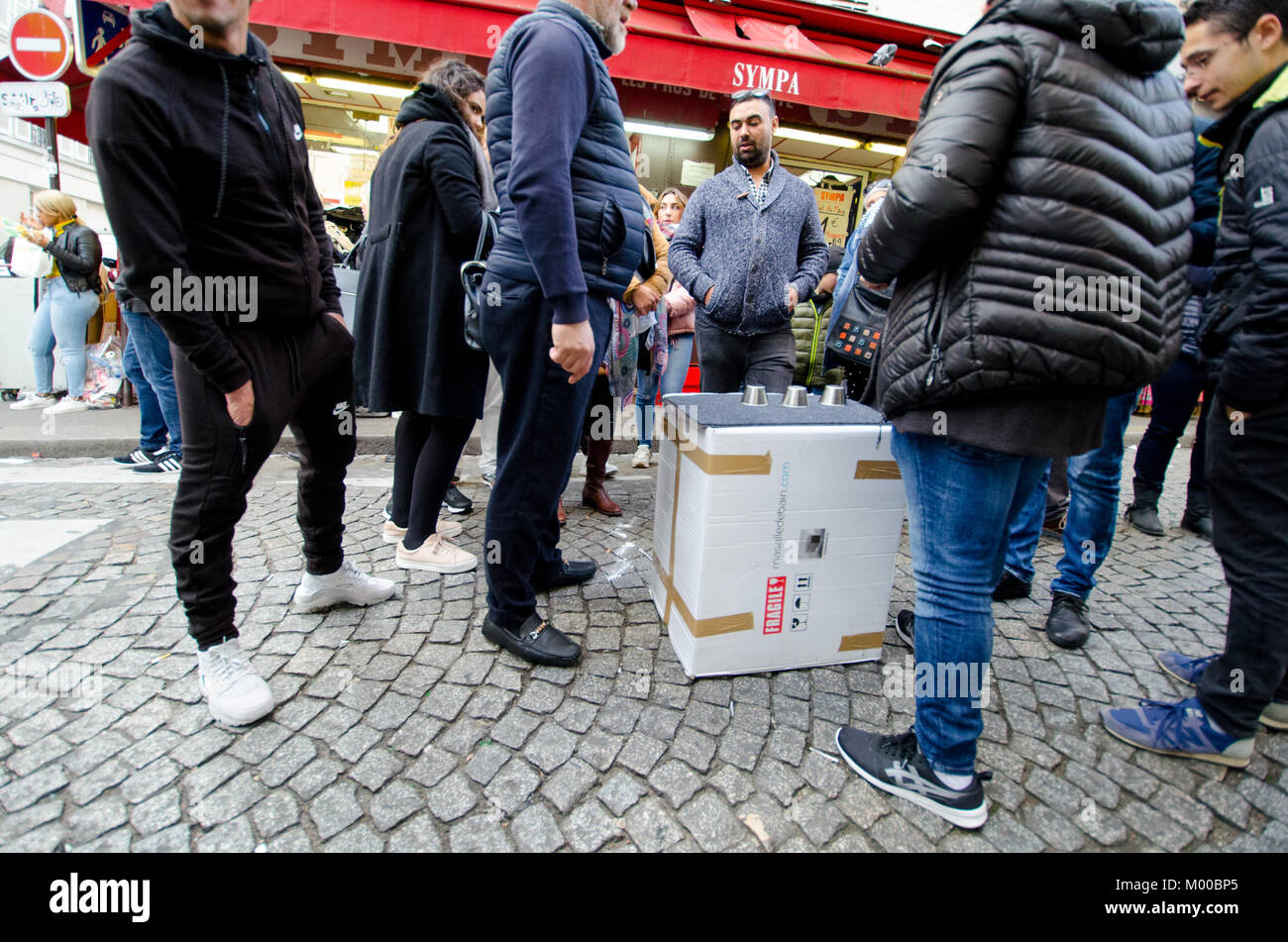 Paris, France. Man in Montmartre doing the 'cup and ball' trick or ...