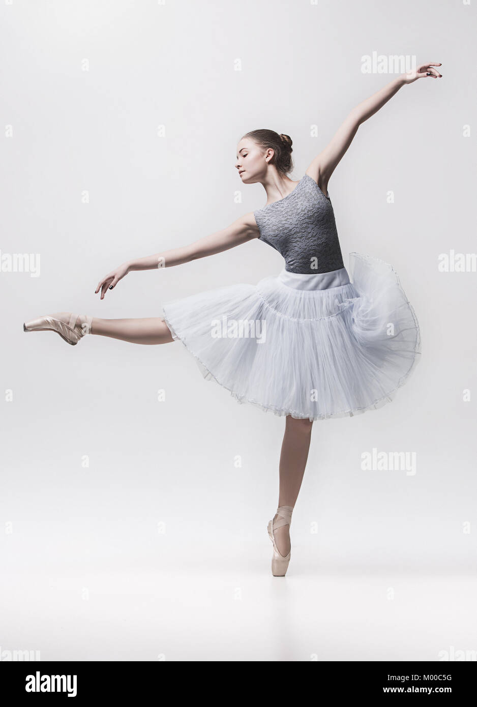 Young classical dancer isolated on white background Stock Photo - Alamy