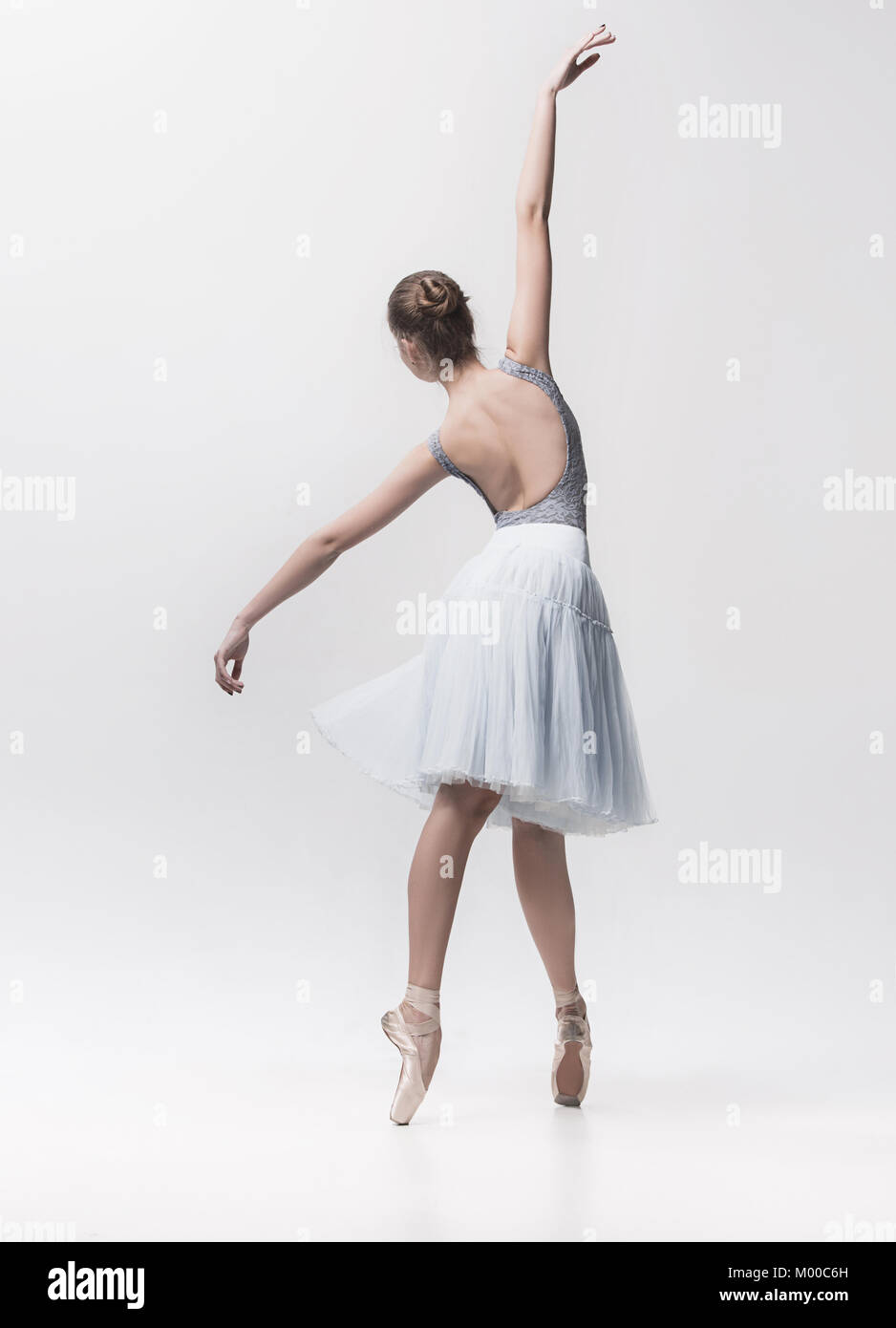Young classical dancer isolated on white background Stock Photo - Alamy