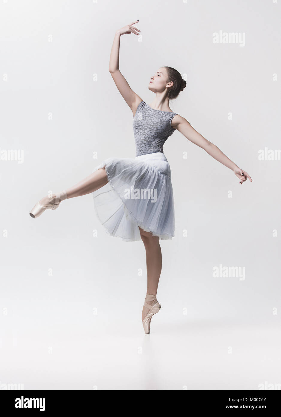 Young classical dancer isolated on white background Stock Photo - Alamy