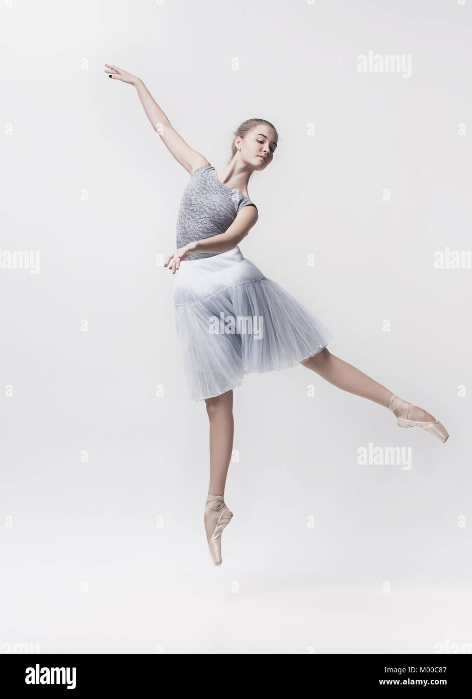 Young classical dancer isolated on white background Stock Photo - Alamy