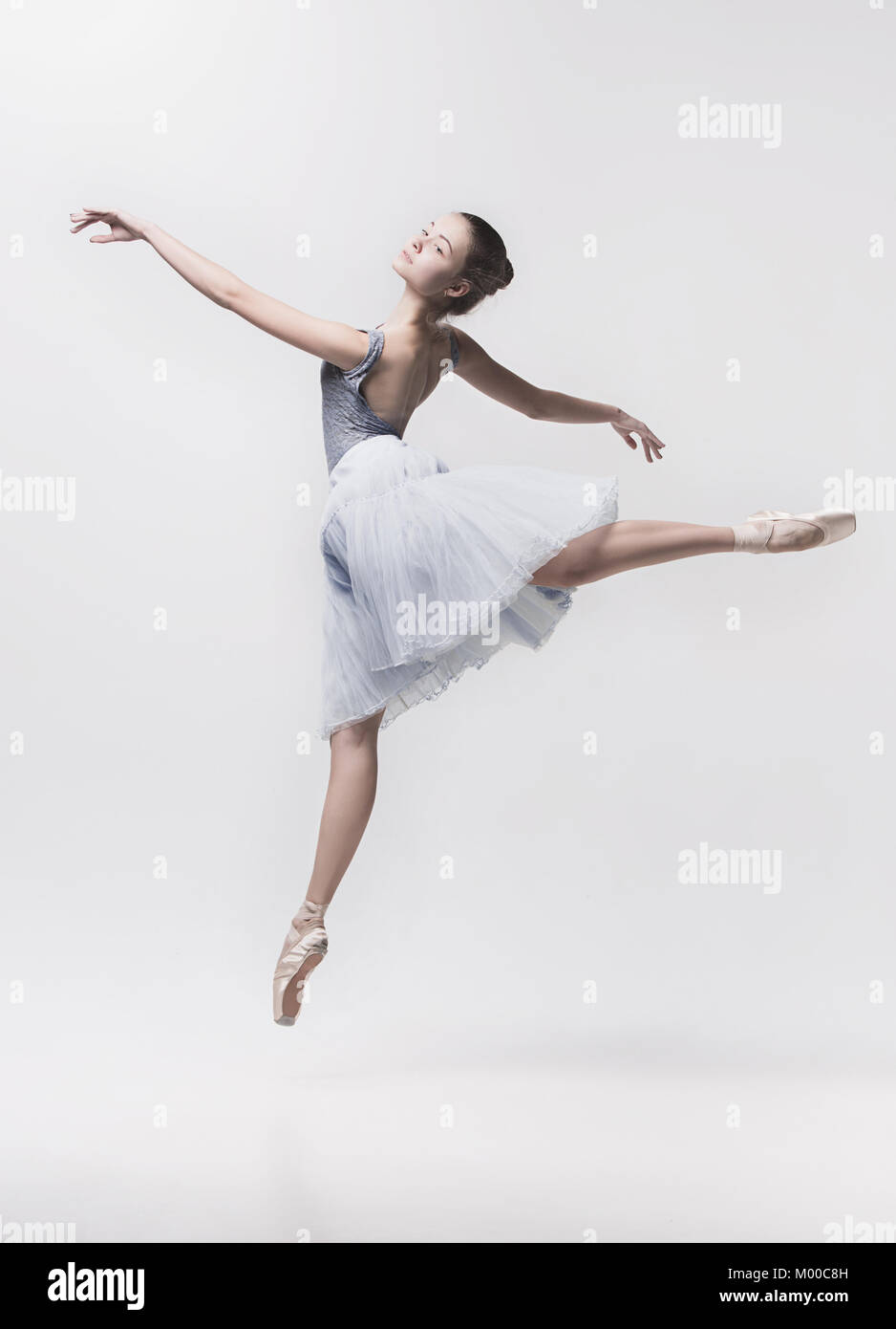 Young classical dancer isolated on white background Stock Photo - Alamy