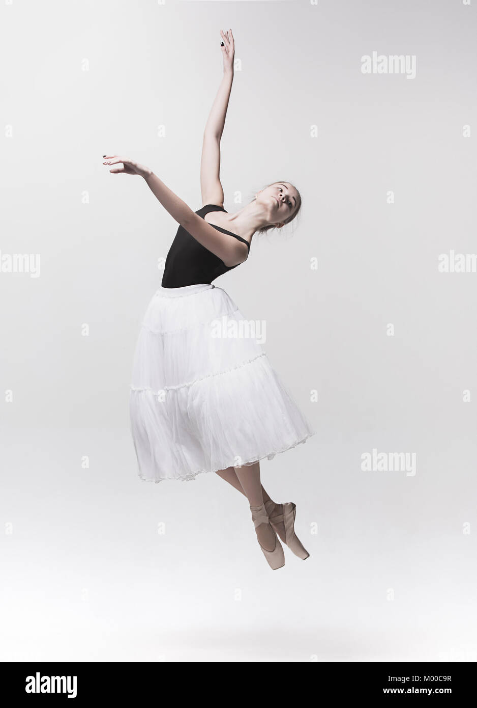 Young classical dancer isolated on white background Stock Photo - Alamy