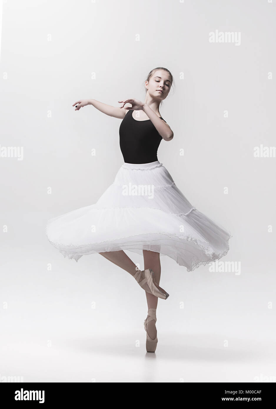 Young classical dancer isolated on white background Stock Photo - Alamy