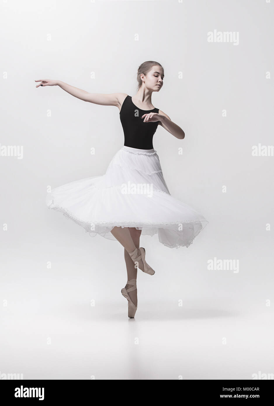 Young classical dancer isolated on white background Stock Photo - Alamy