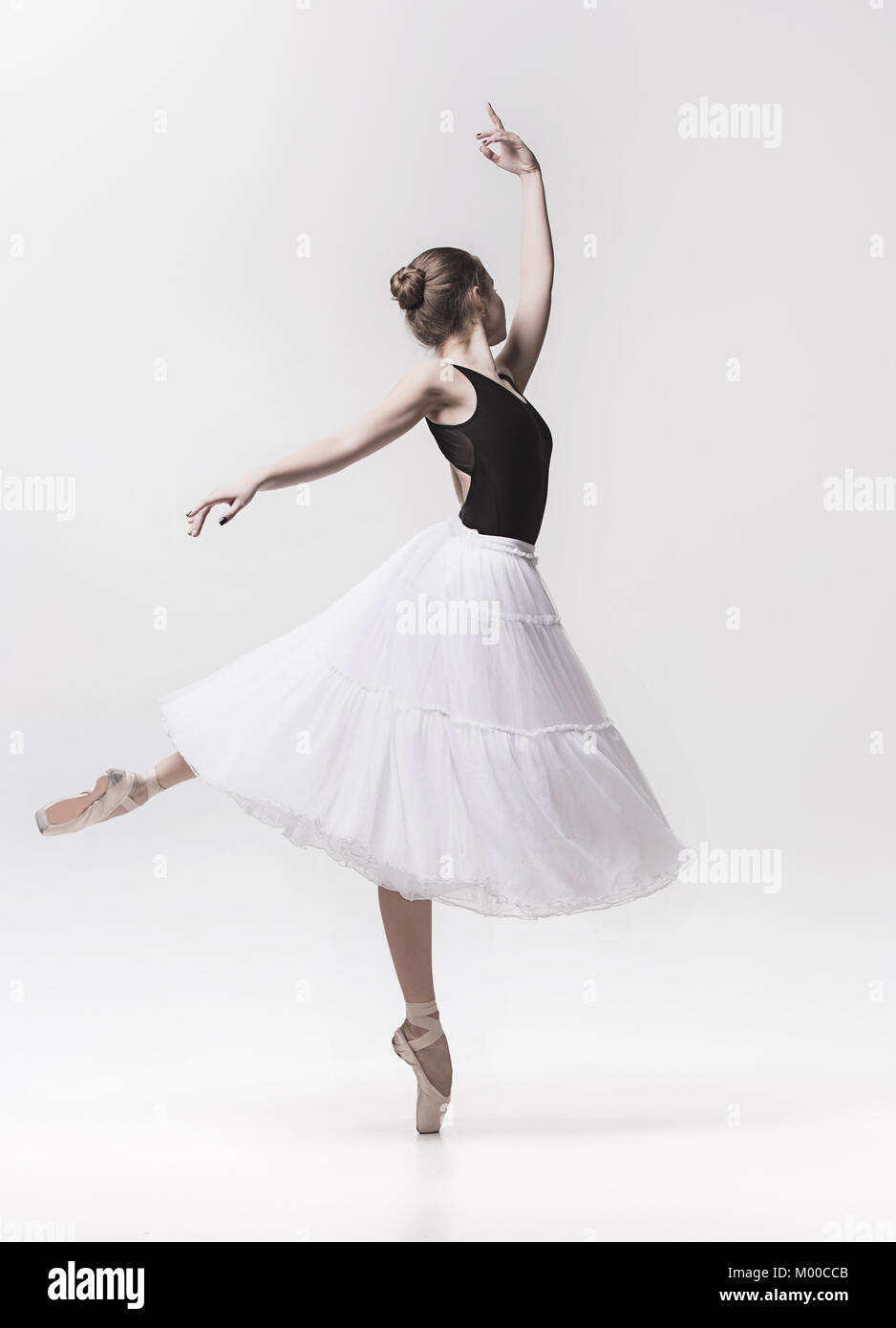Young classical dancer isolated on white background Stock Photo - Alamy