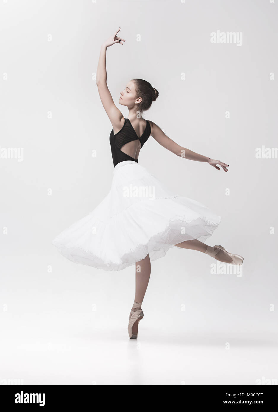 Young classical dancer isolated on white background Stock Photo - Alamy