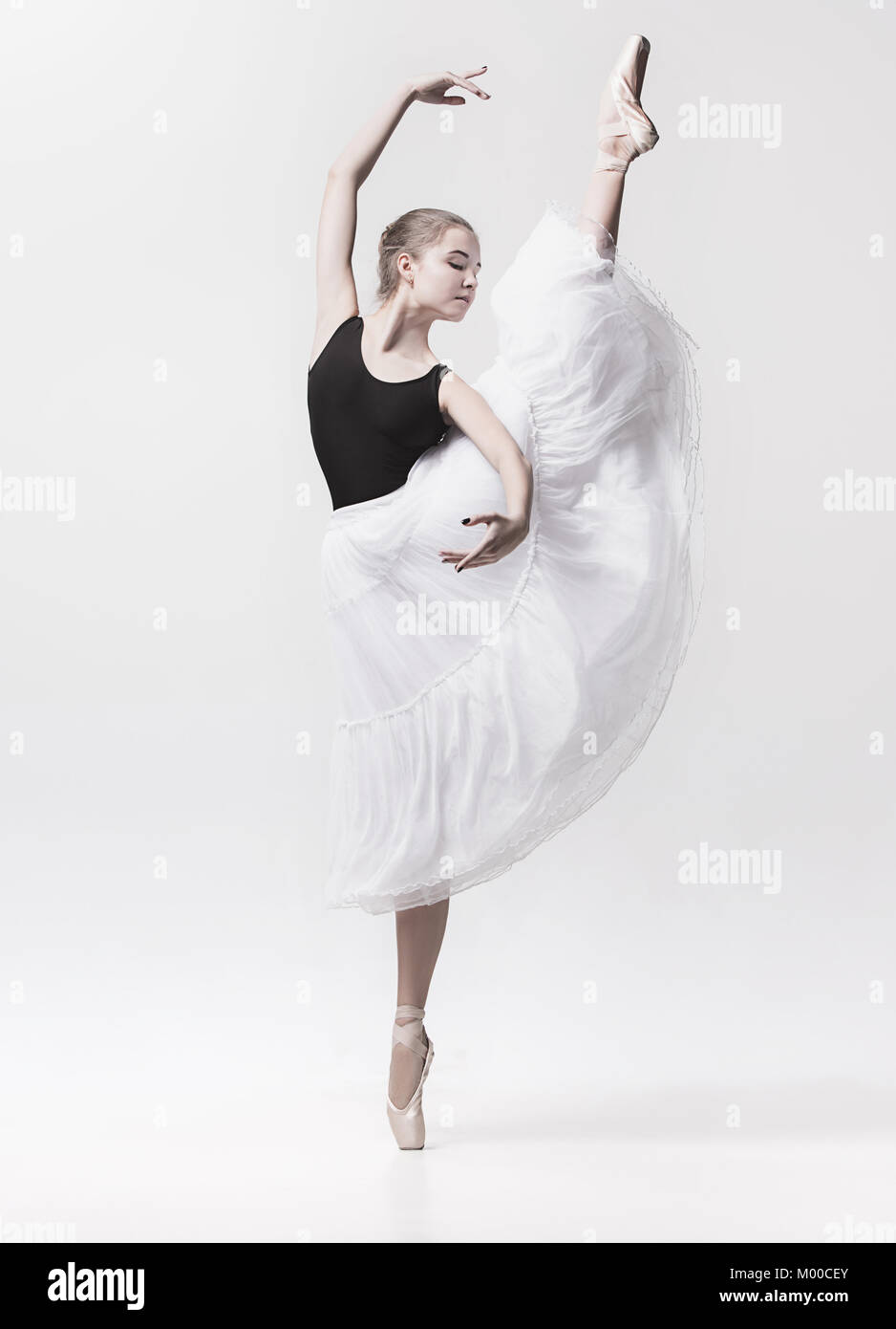 Young classical dancer isolated on white background Stock Photo - Alamy