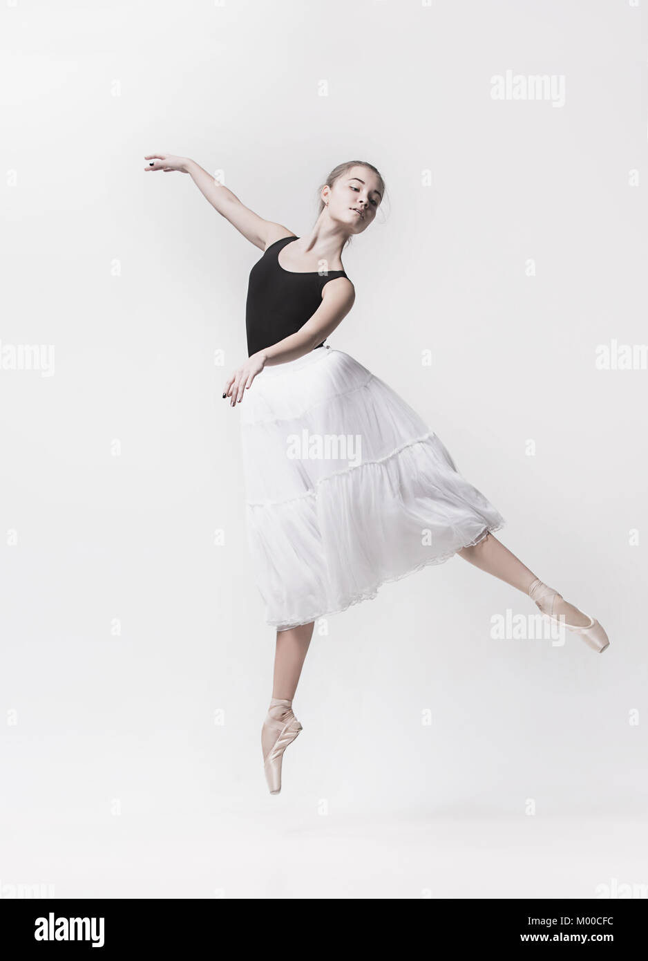 Young classical dancer isolated on white background Stock Photo - Alamy